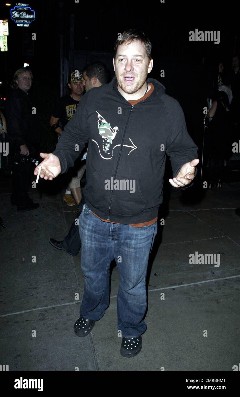 Jeff Richards turns a video camera around on the crowd of photographers as he talks to them ...