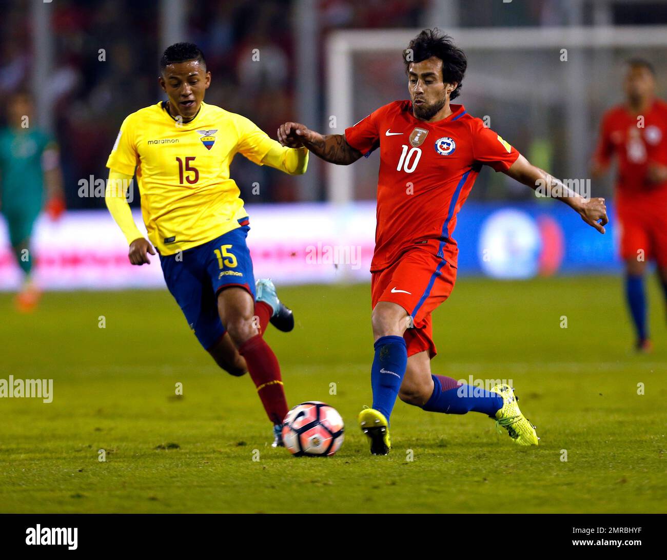 Chile's Jorge Valdivia, right, fights for the ball against Ecuador's ...