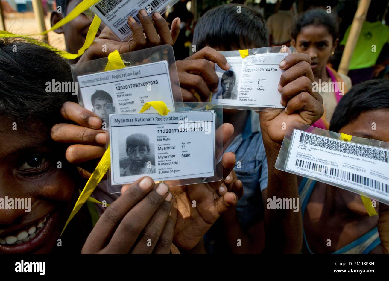 In this Sunday, Oct. 1, 2017, photo, Rohingya children display their ...