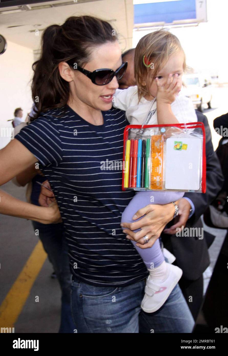A casually dressed Jennifer Garner arrives at LAX with her daughters ...
