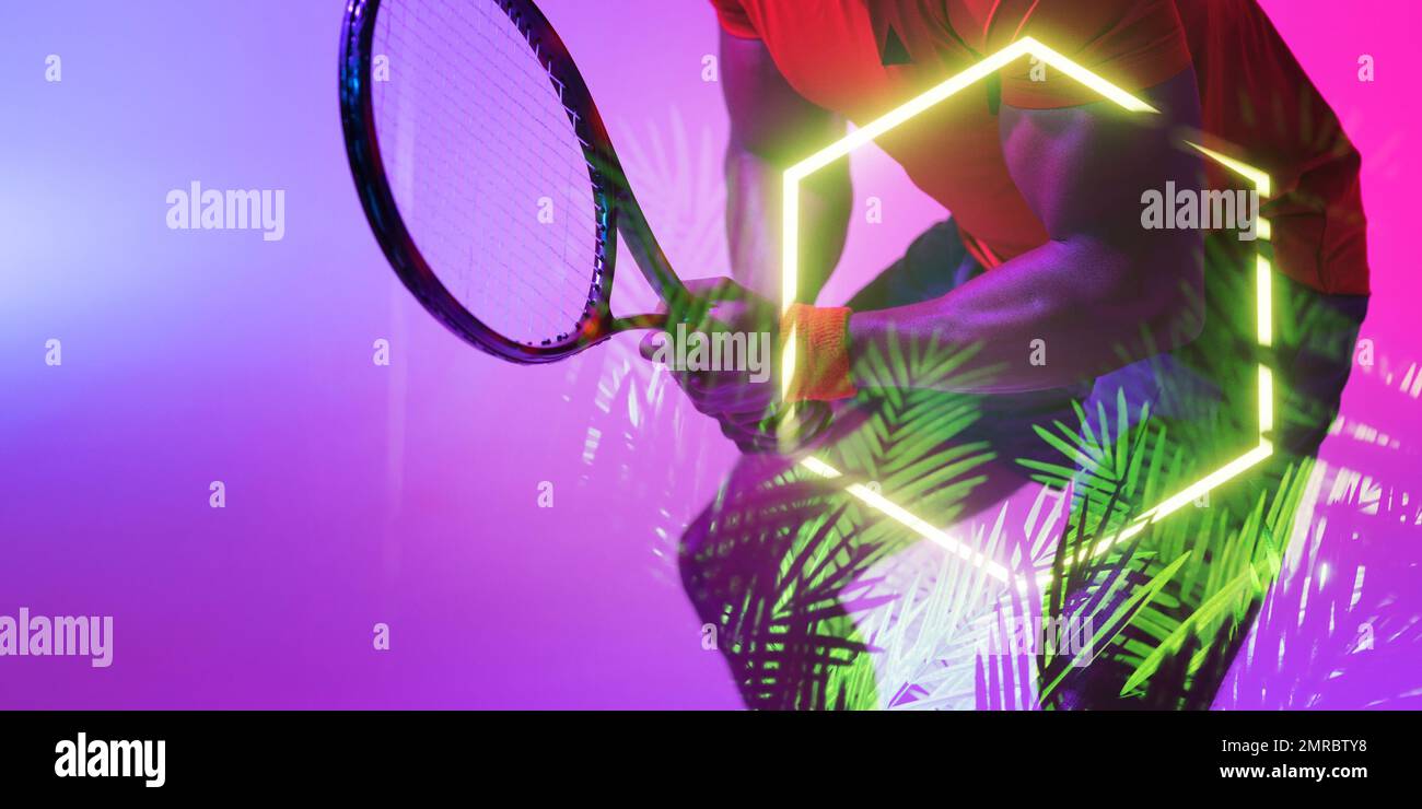 Illuminated plants and hexagon over midsection of african american male ...