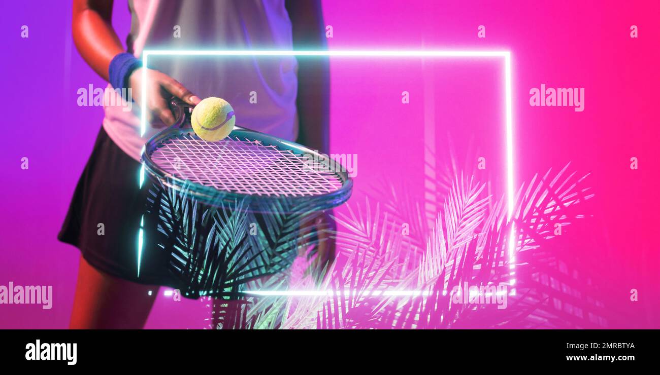 Midsection of african american female tennis player with racket and ...