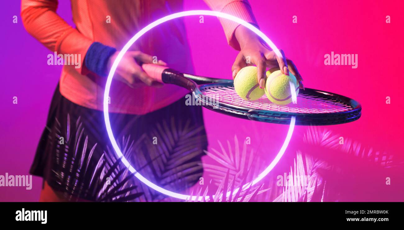 Illuminated circle and plant over midsection of african american female ...