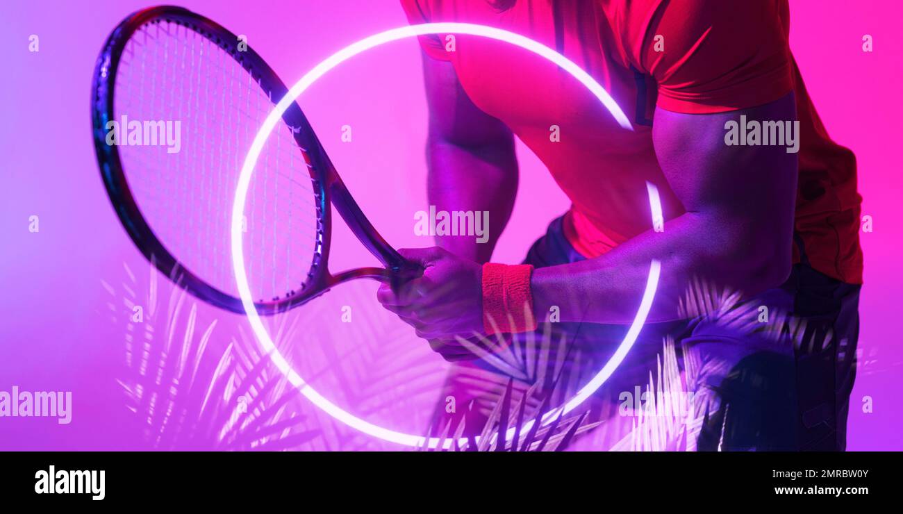 Illuminated plants and circle over midsection of african american male ...