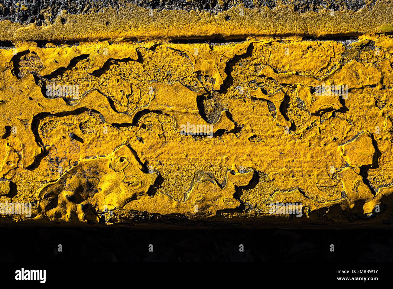 Yellow Colored Area on a Walkway Stock Photo - Alamy