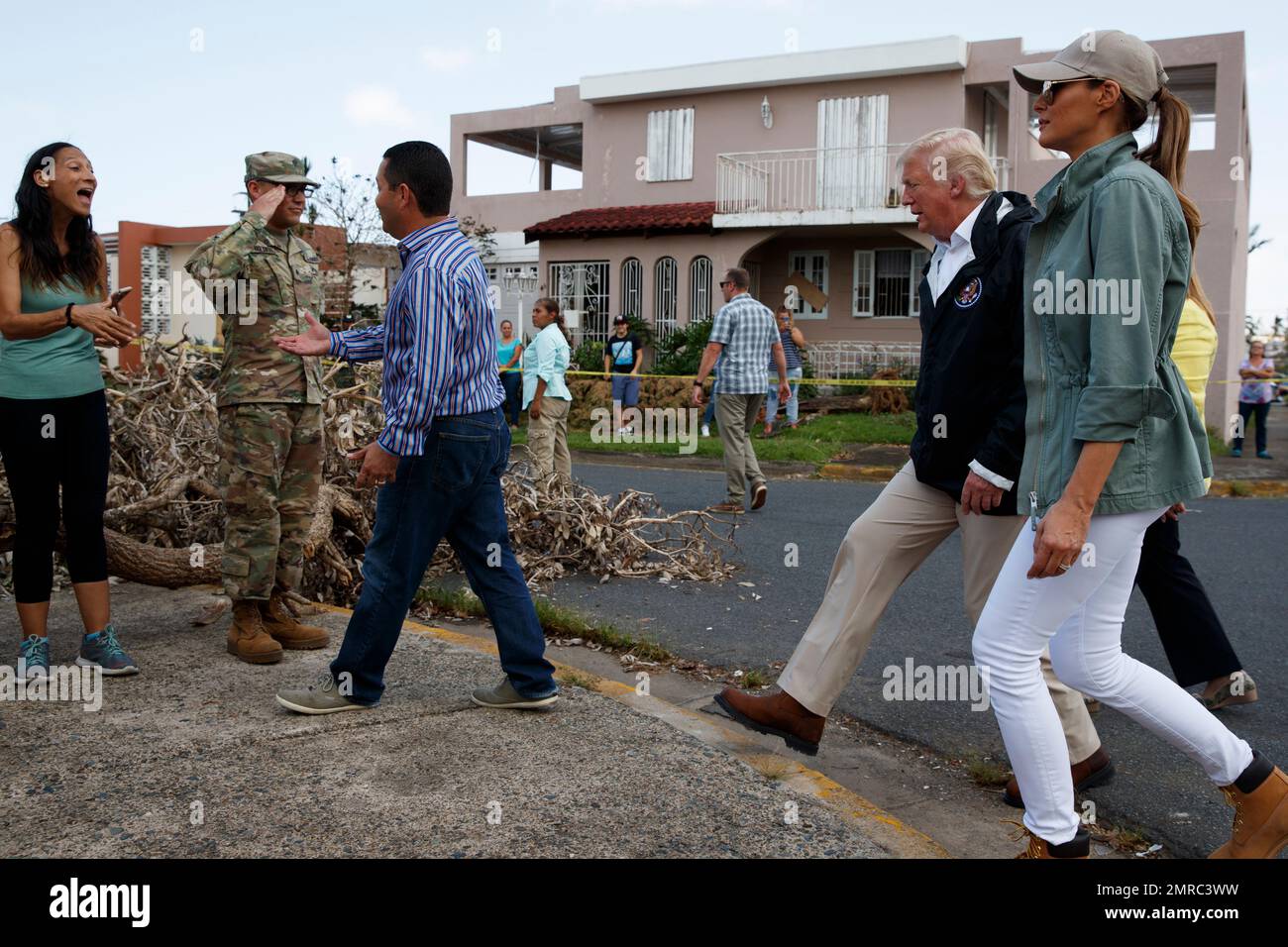 President Donald Trump and first lady Melania Trump tour a neighborhood ...
