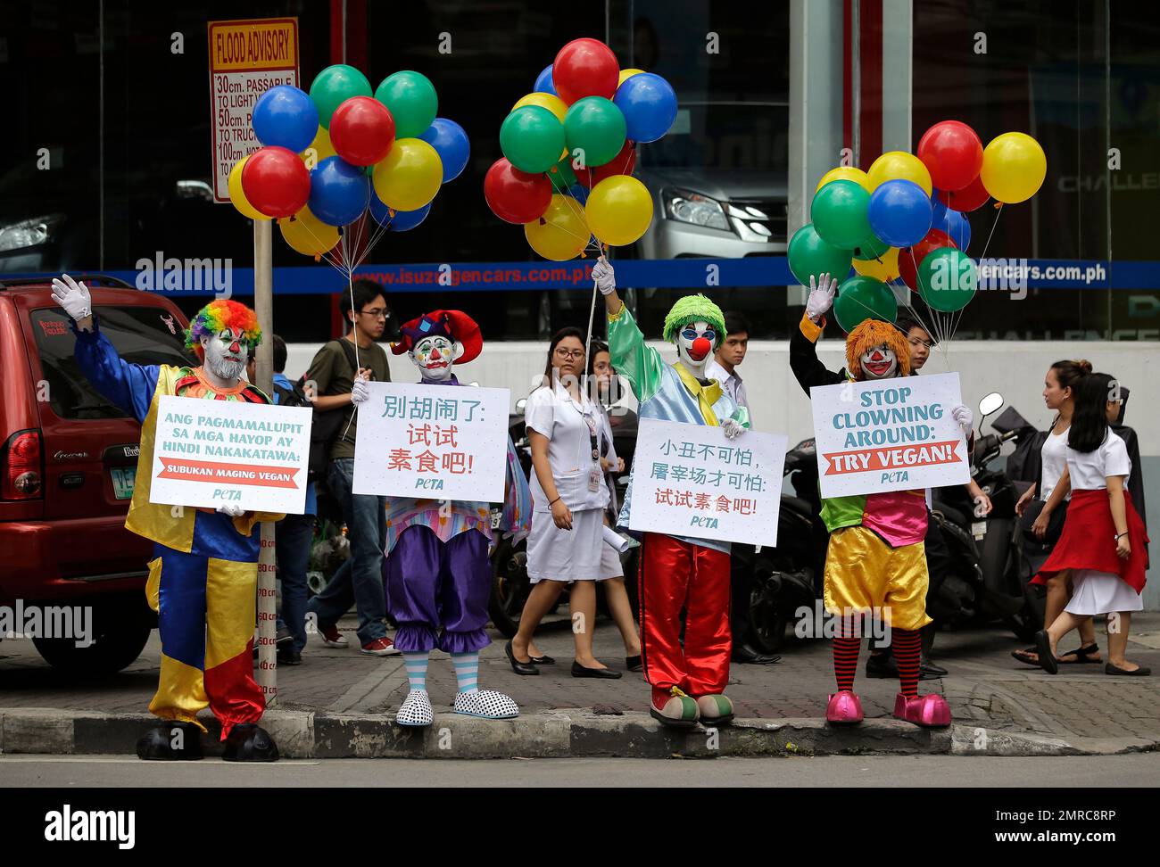 Filipino clowns hold slogans during a demonstration in metropolitan ...