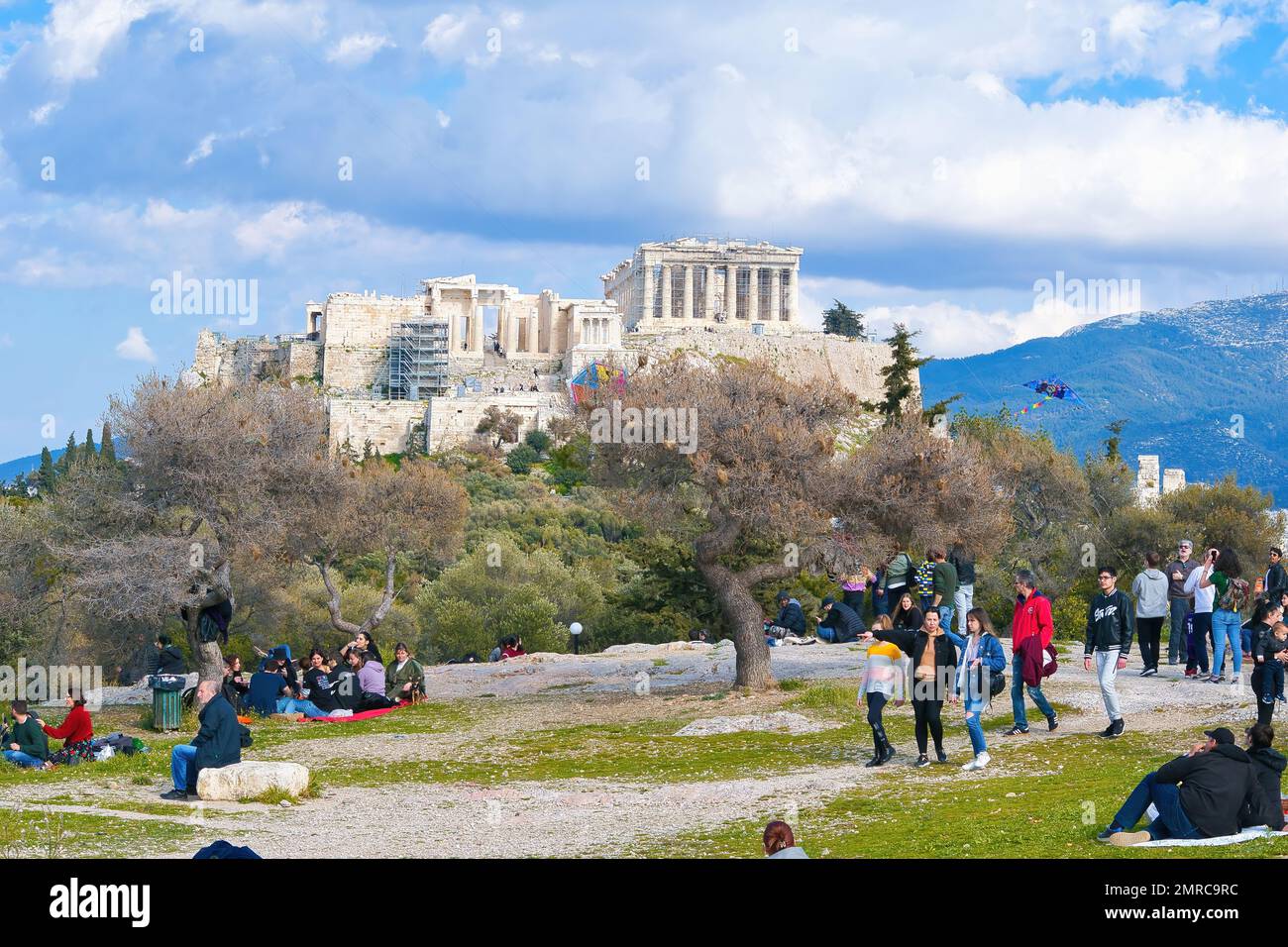 A crowd of tourists around the Acropolis of Athens Unesco heritage with the Parthenon Stock ...
