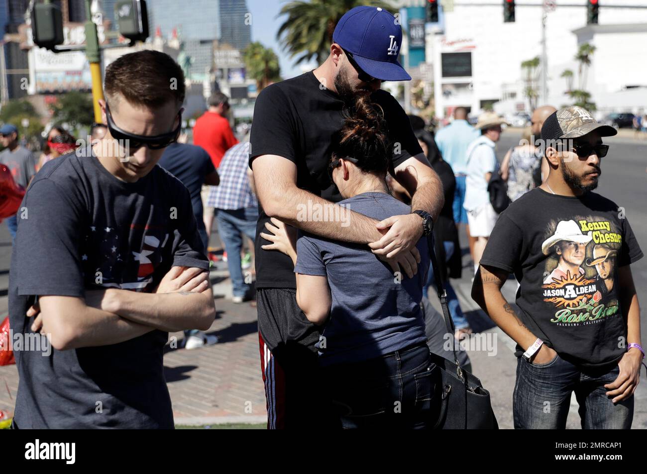 Reed Broschart, center, hugs his girlfriend Aria James on the Las Vegas ...