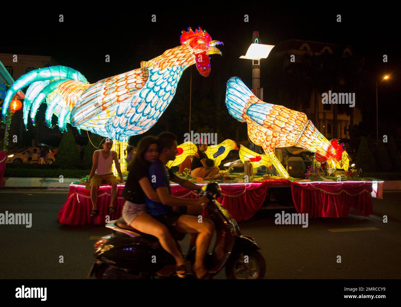 Chicken lanterns parade through the streets to celebrate the Mid-Autumn ...