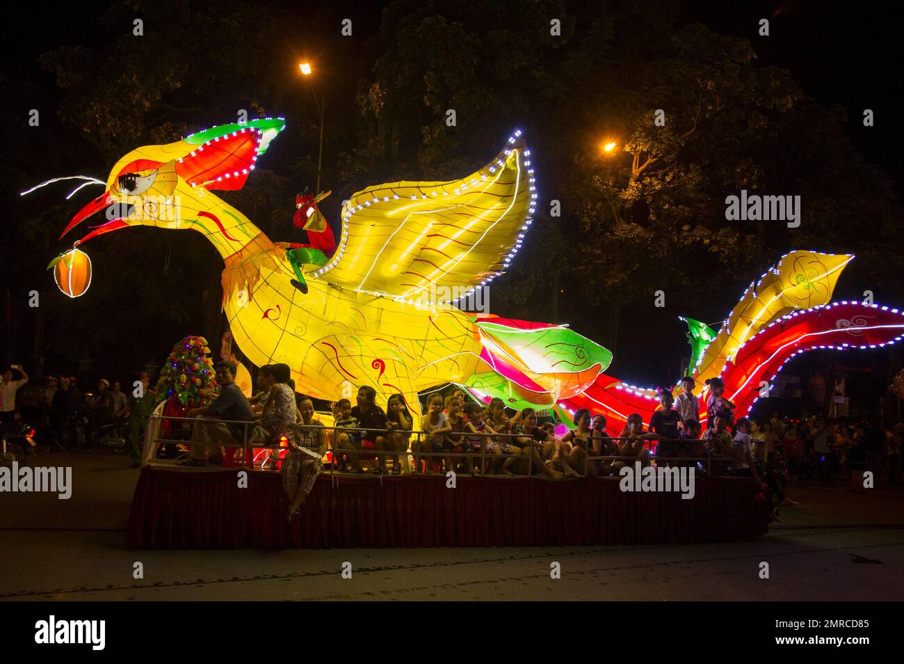A phoenix lantern float parades through the streets to celebrate the ...