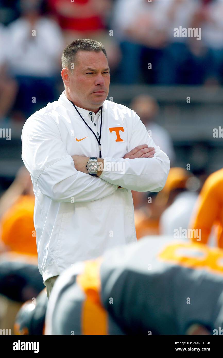 Tennessee head coach Butch Jones walks between his players before an ...