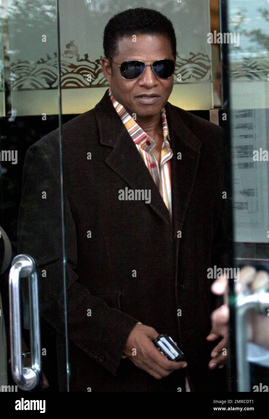 Michael Jackson's brothers Jermaine and Jackie Jackson are all smiles ...