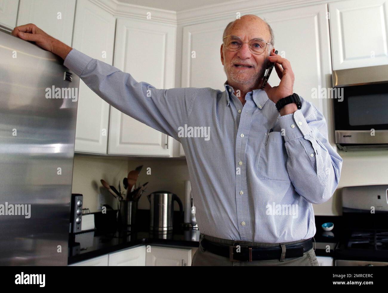 Michael Rosbash takes a phone call at his home, Monday, Oct. 2, 2017 ...