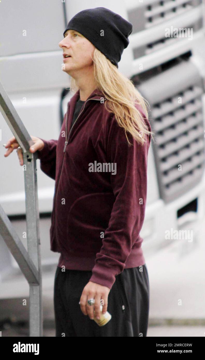 American guitarist Jerry Cantrell of Alice in Chains smokes a cigarette ...