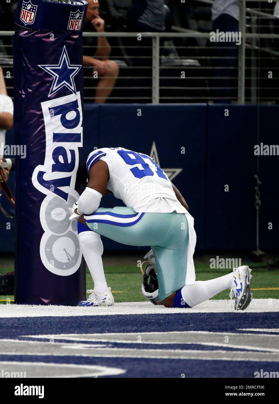 Dallas Cowboys defensive end Taco Charlton (97) kneels by the end zone ...