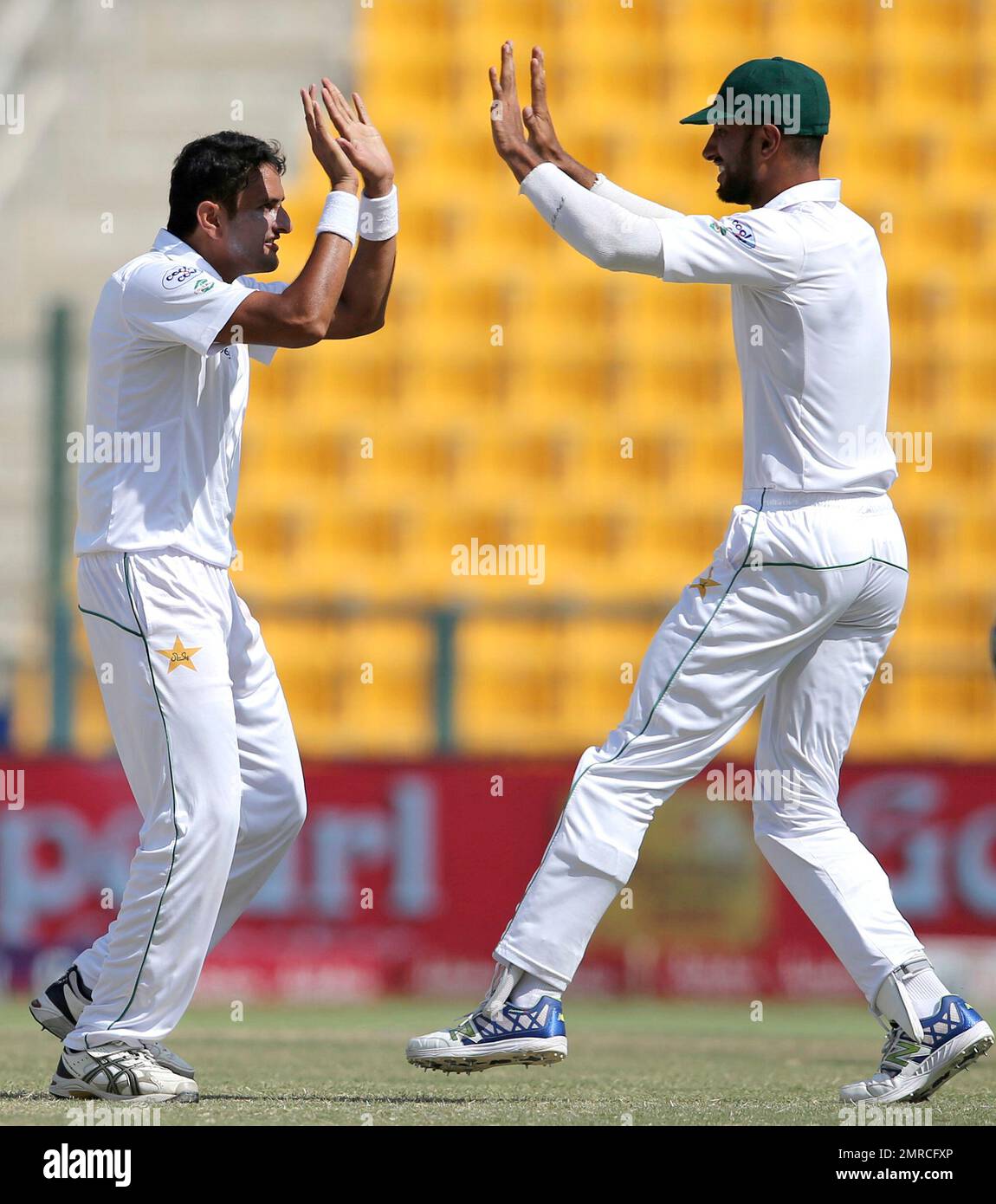 Pakistan bowler Pakistan's Muhammad Abbas, left, celebrates the ...