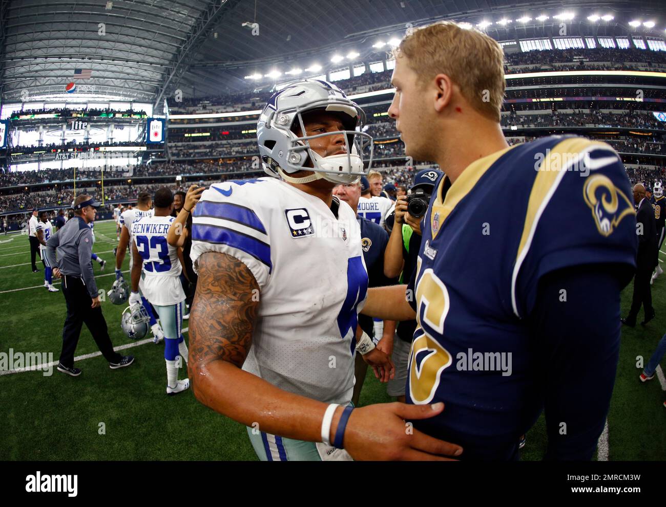 Dallas Cowboys' Dak Prescott (4) and Los Angeles Rams' Jared Goff ...