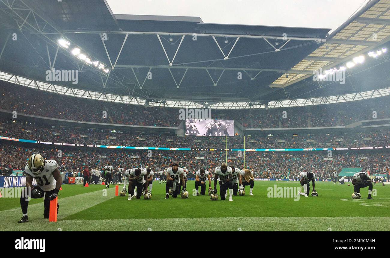 New Orleans Saints players pray after taking the field for an NFL ...