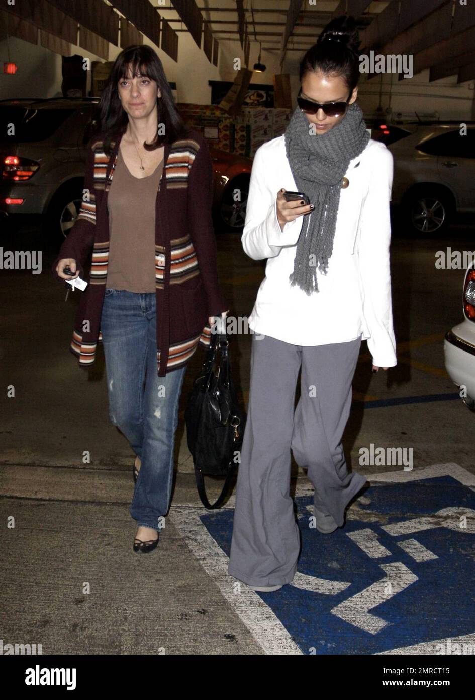 Jessica Alba wraps ups with a neck scarf during a visit to Whole Foods ...