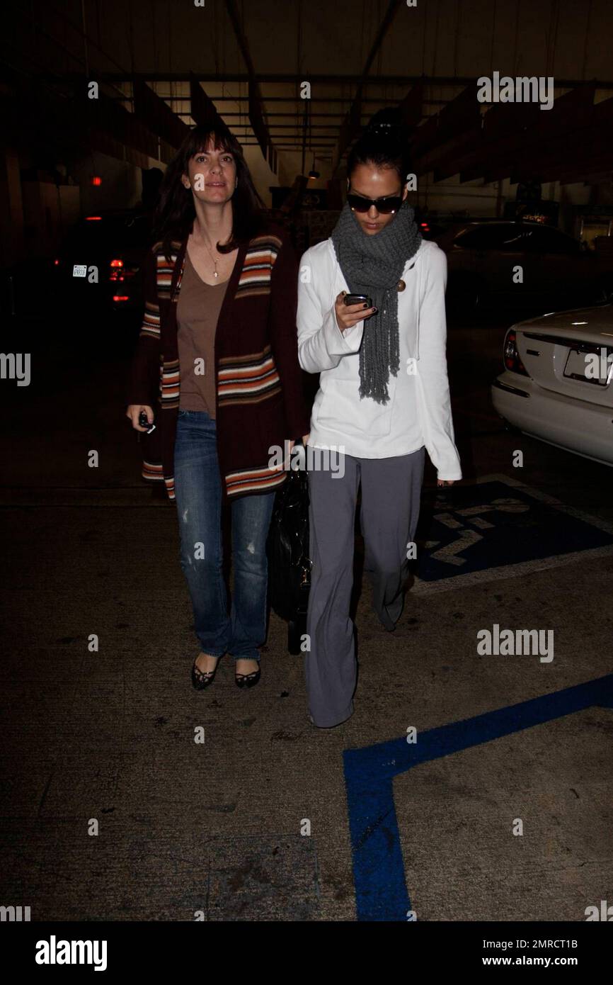 Jessica Alba wraps ups with a neck scarf during a visit to Whole Foods ...