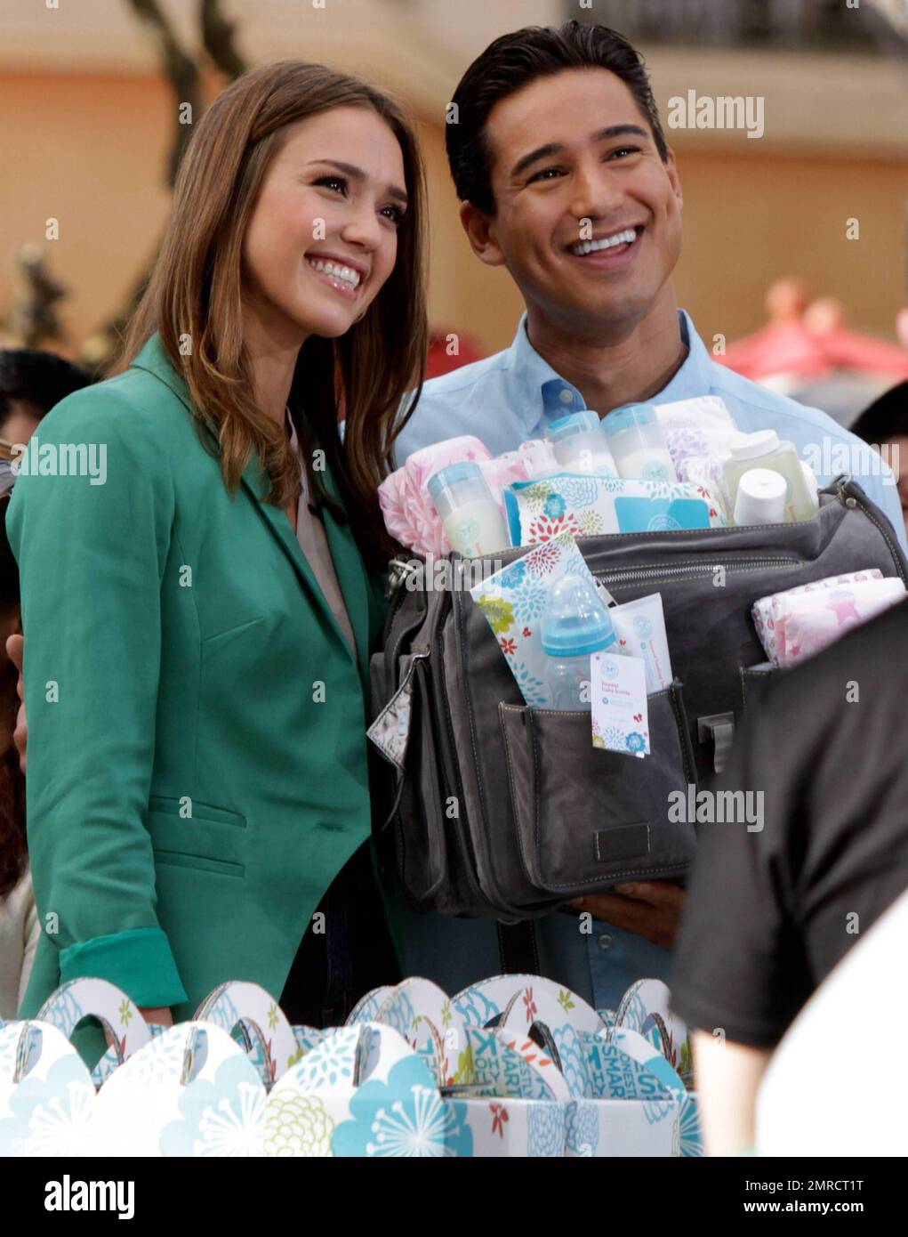 Wearing a green jacket and jeans, Jessica Alba looks super thin as she ...