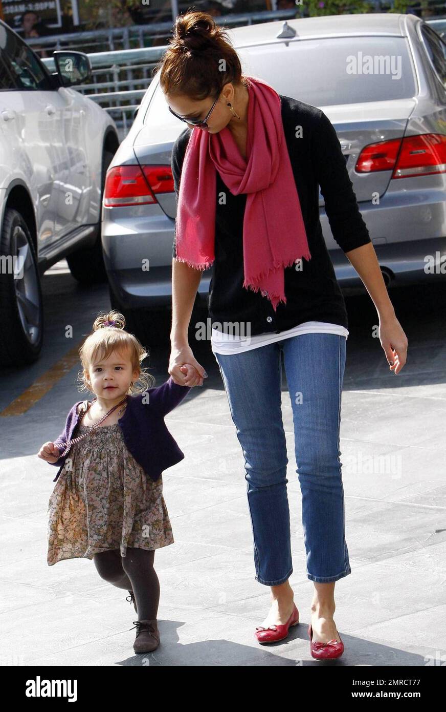 Doting mom Jessica Alba looks on as her daughter Honor practices ...