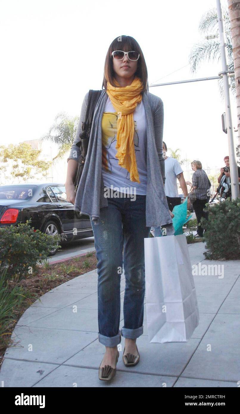 A casually dressed Jessica Alba sports a new hairdo as she waits at the ...