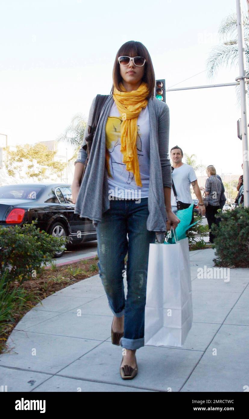 A casually dressed Jessica Alba sports a new hairdo as she waits at the ...