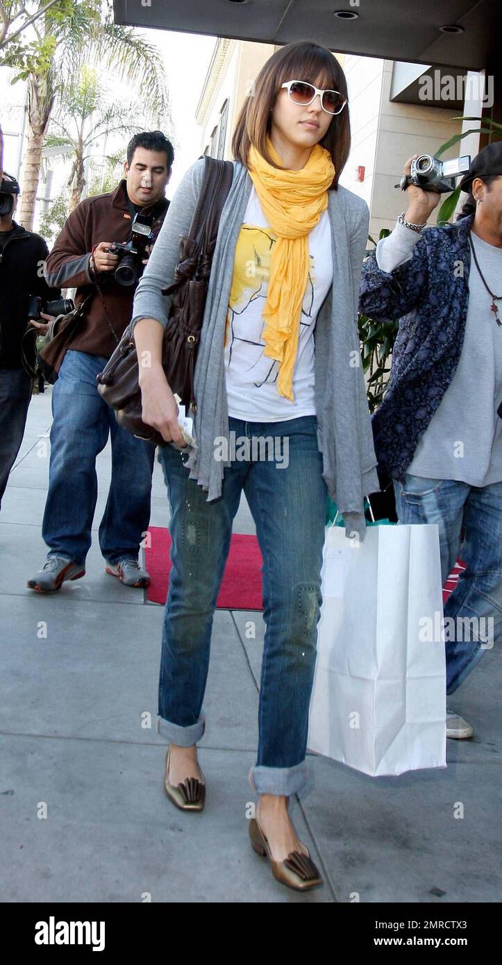 A casually dressed Jessica Alba sports a new hairdo as she waits at the ...