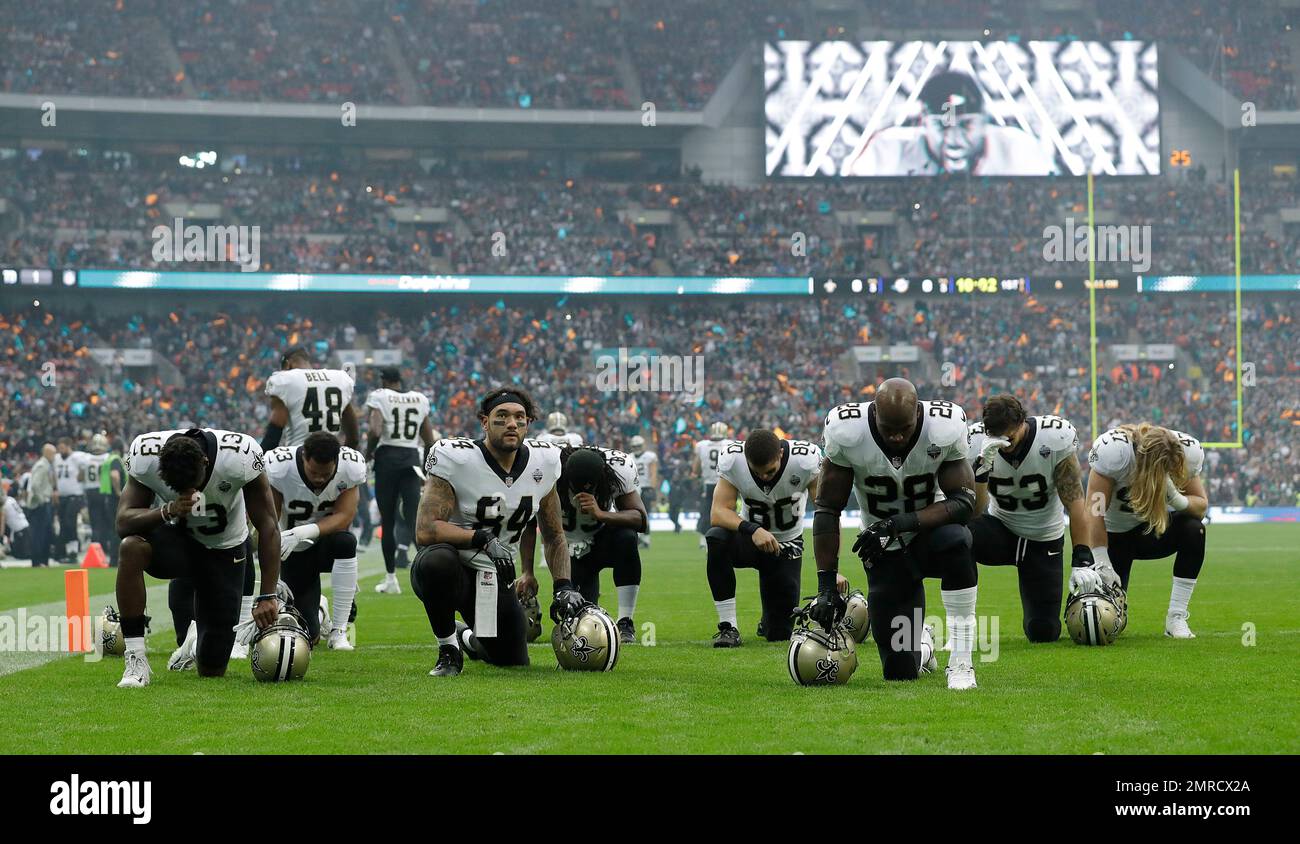 New Orleans Saints players pray after taking the field for an NFL ...