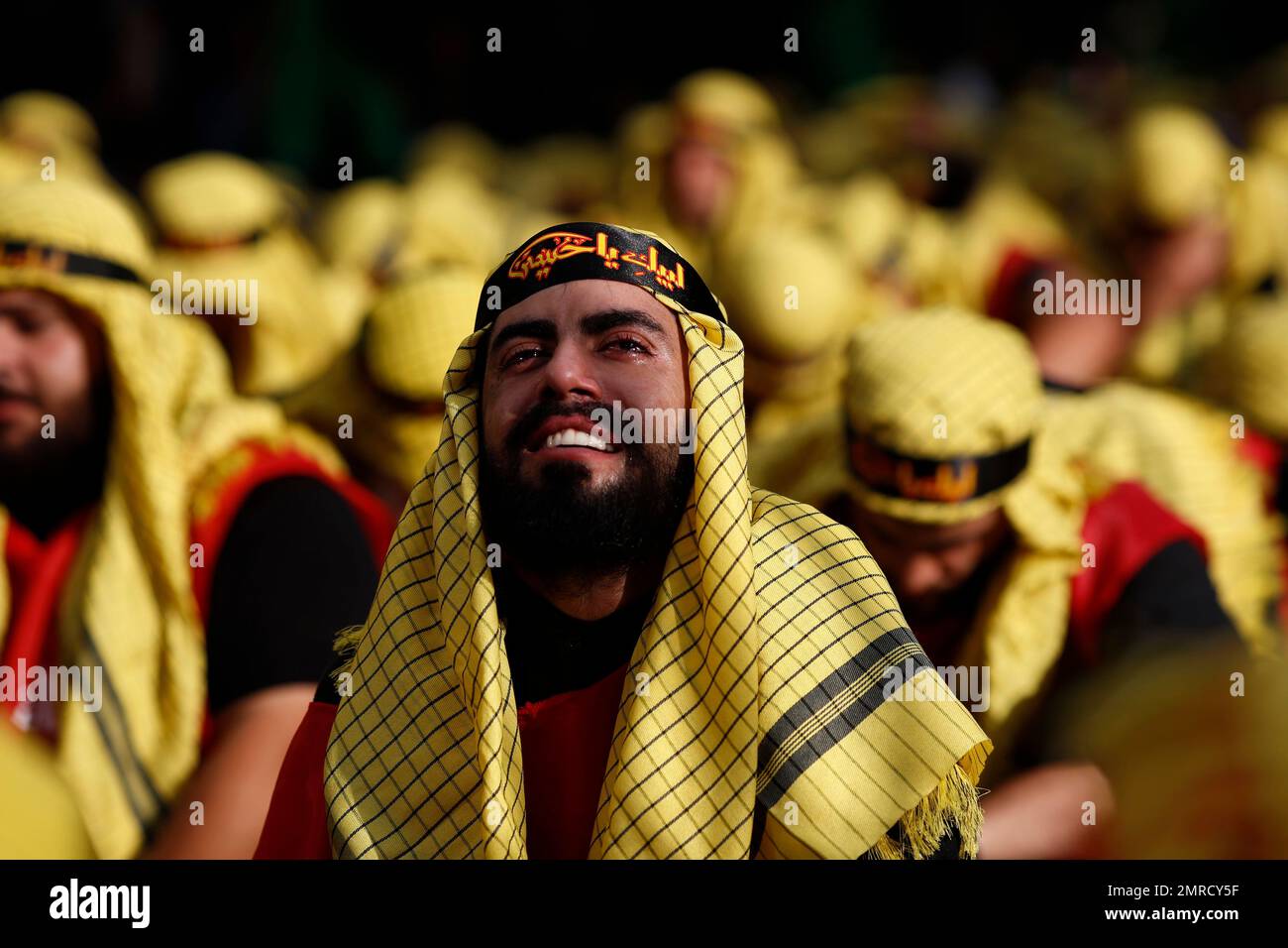 Lebanese Shiite supporters of Hezbollah cry as listen to the story of ...