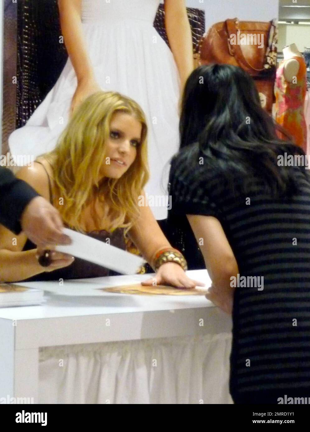 Singer and entrepreneur Jessica Simpson signs autographs for fans at a ...