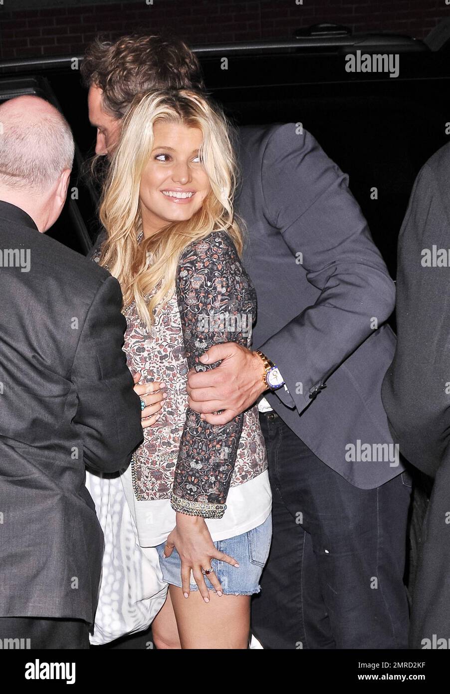 Jessica Simpson is all smiles as she and fiance Eric Johnson along with ...