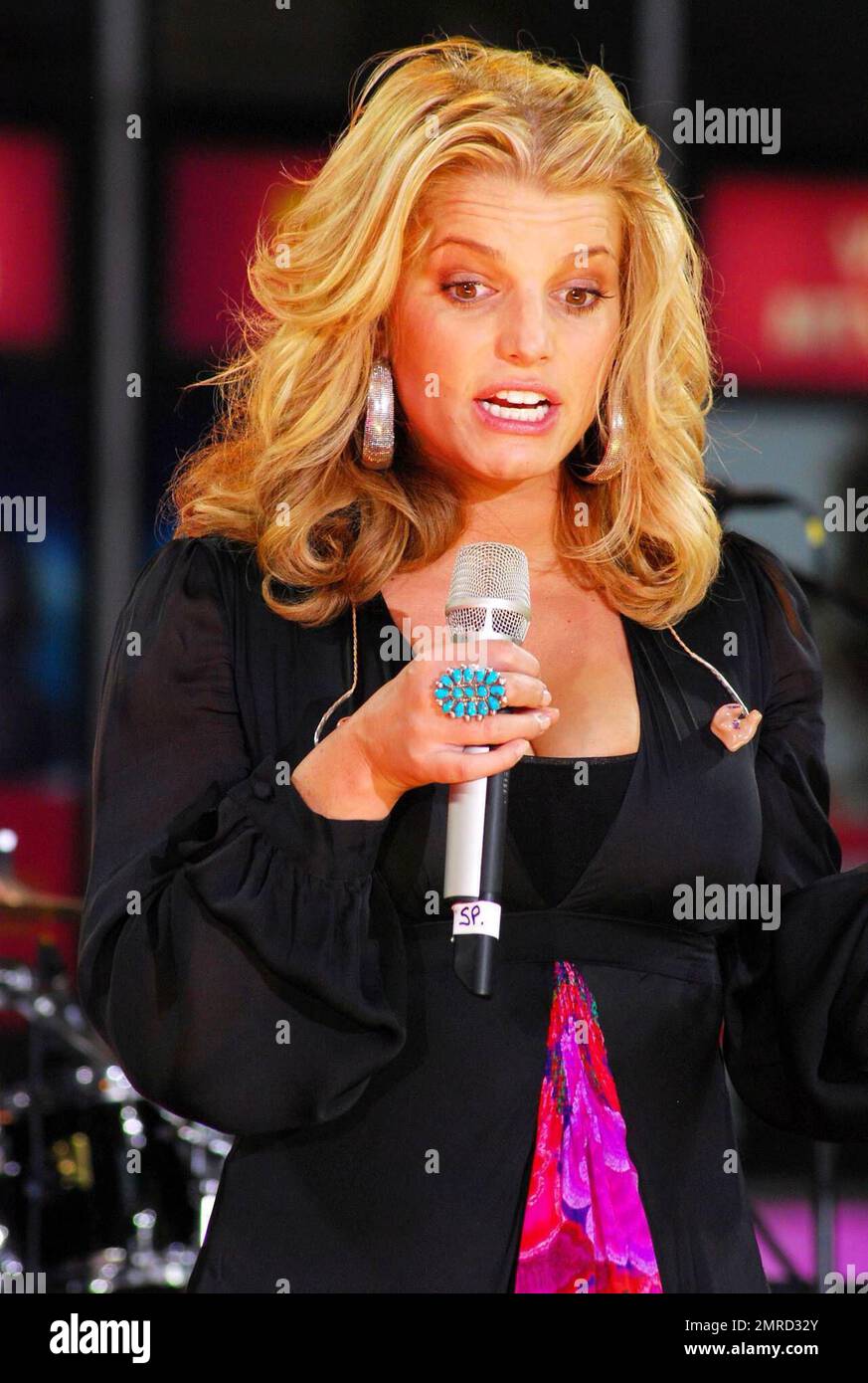 A noticiably heavier than usual and very busty Jessica Simpson performs ...