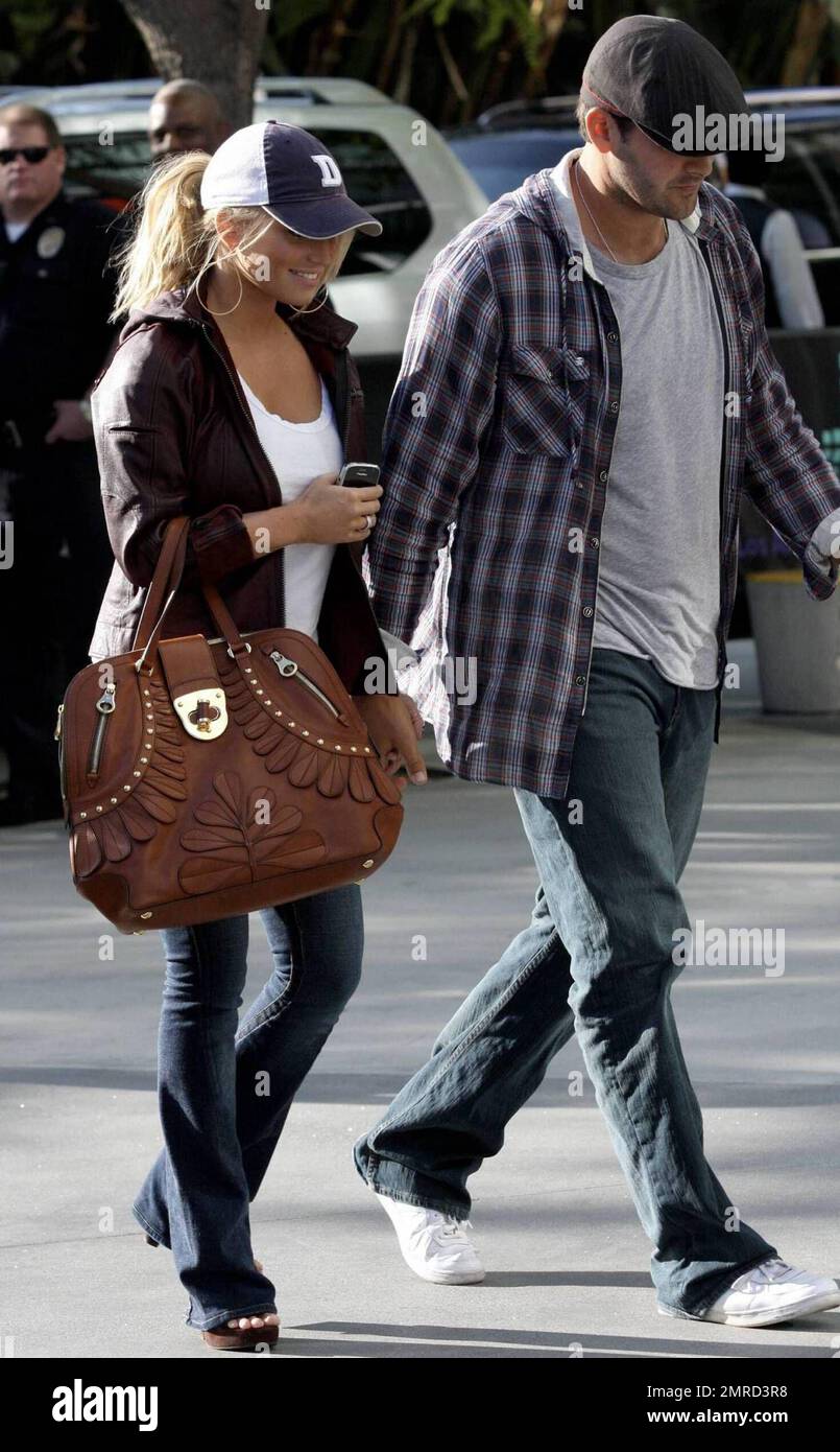 Jessica Simpson covers up her long blonde locks with a baseball cap as ...