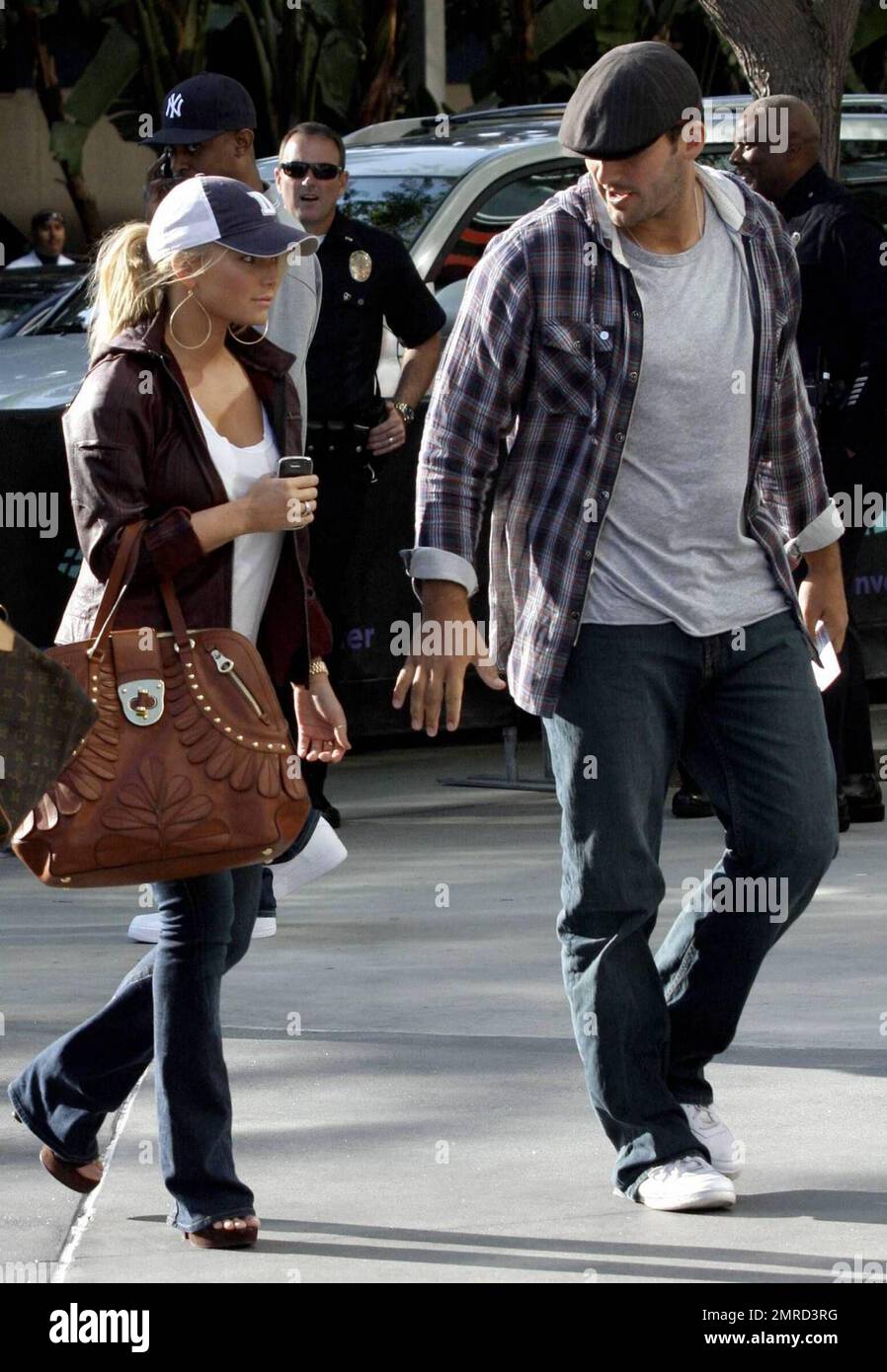 Jessica Simpson covers up her long blonde locks with a baseball cap as ...