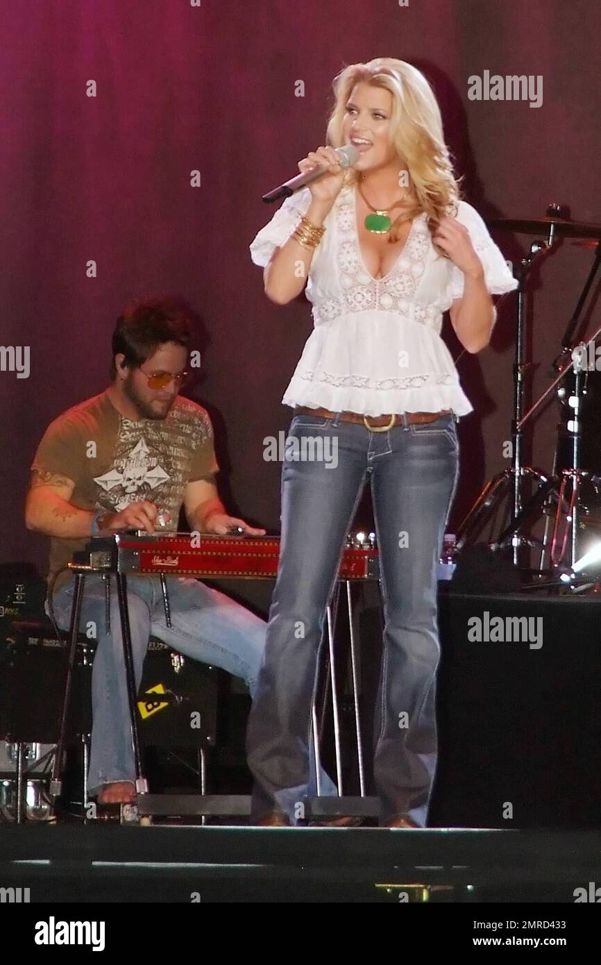 Jessica Simpson wears a lace top with a plunging neckline as she ...