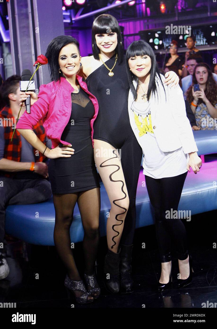 Wearing a black unitard with one black leg and a white one with a black ...