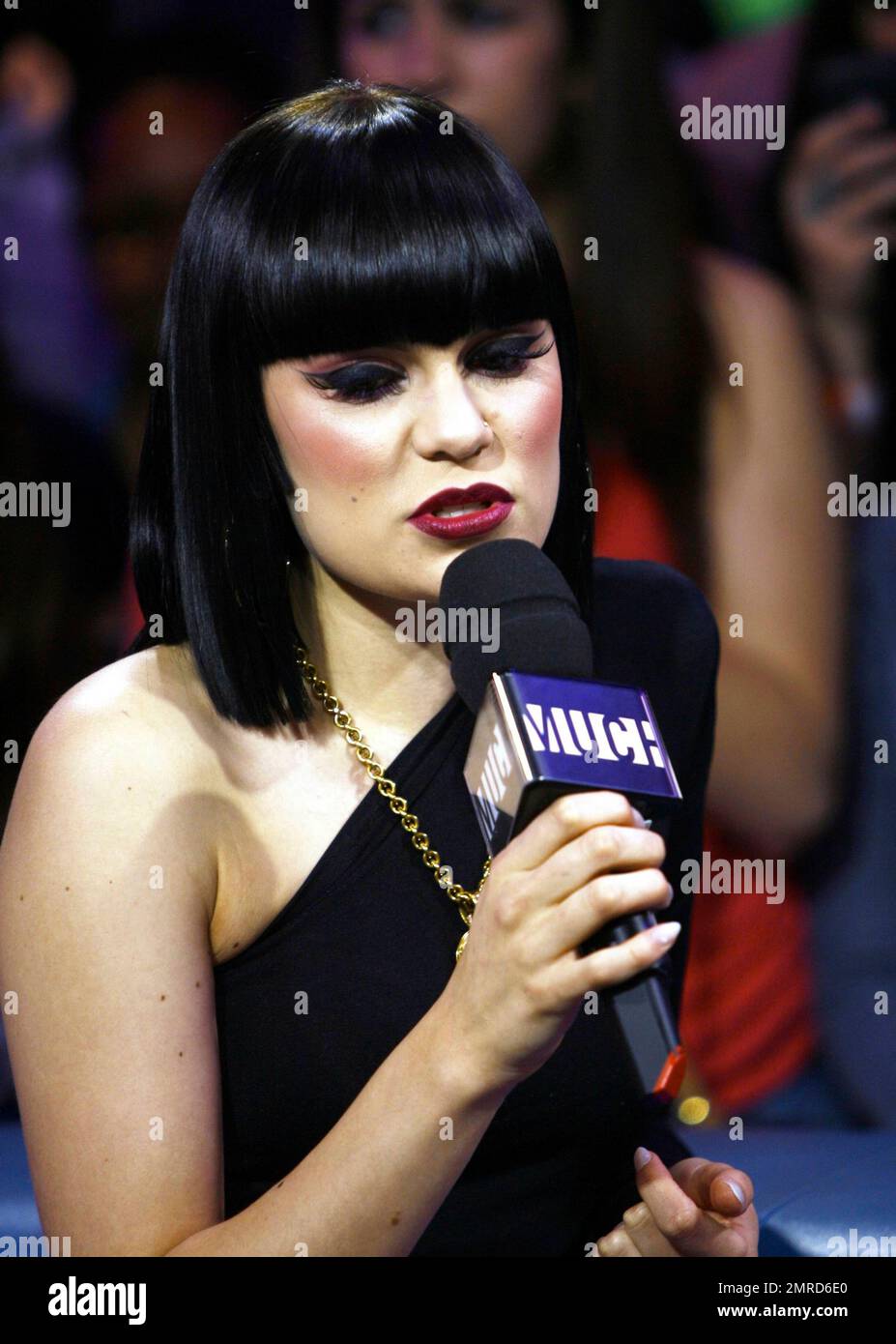 Wearing a black unitard with one black leg and a white one with a black ...