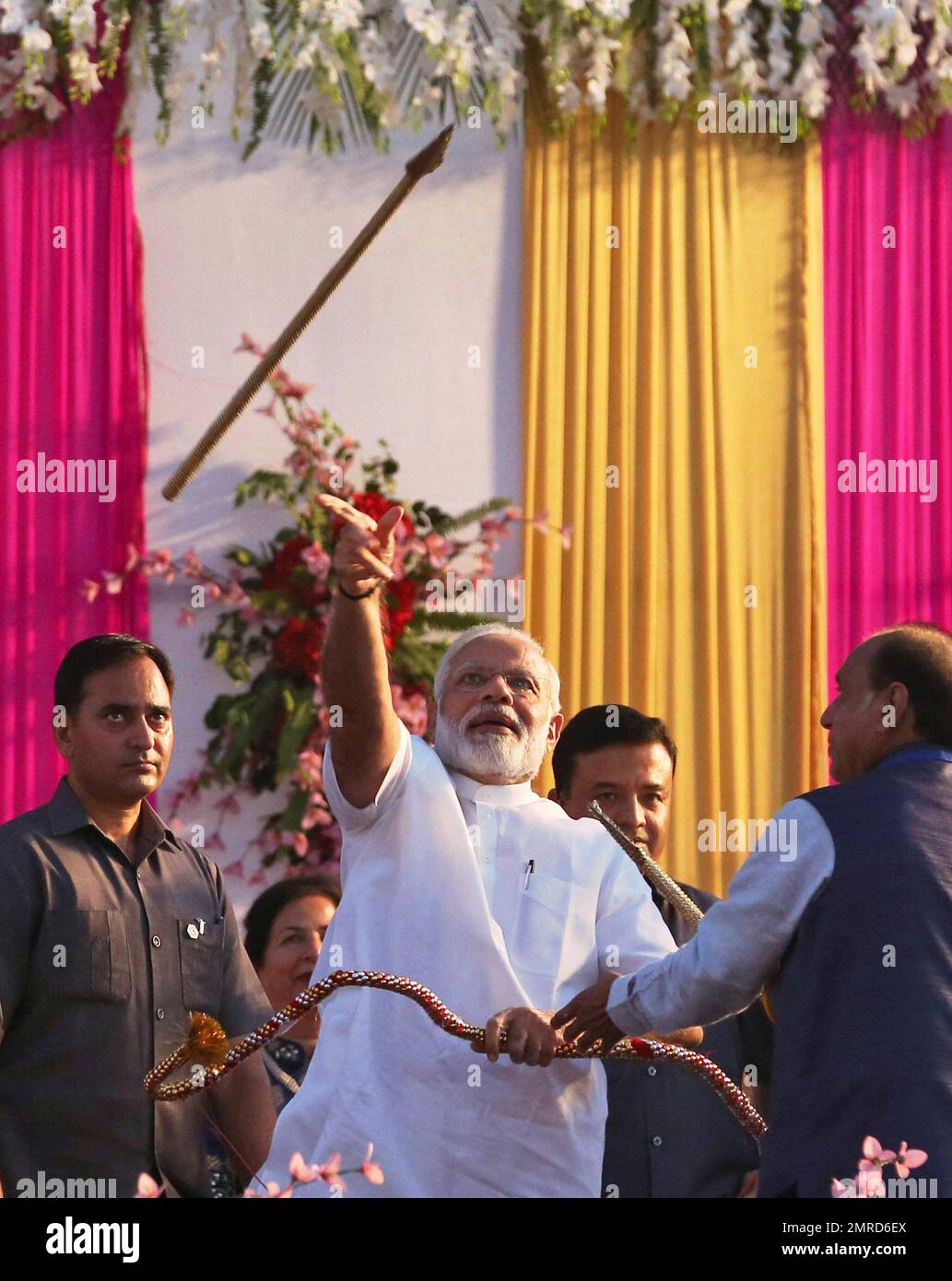 ALTERNATE CROP- Indian Prime Minister Narendra Modi throws an arrow ...