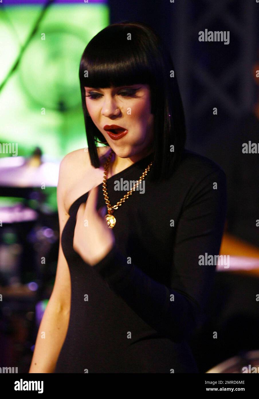 Wearing a black unitard with one black leg and a white one with a black ...