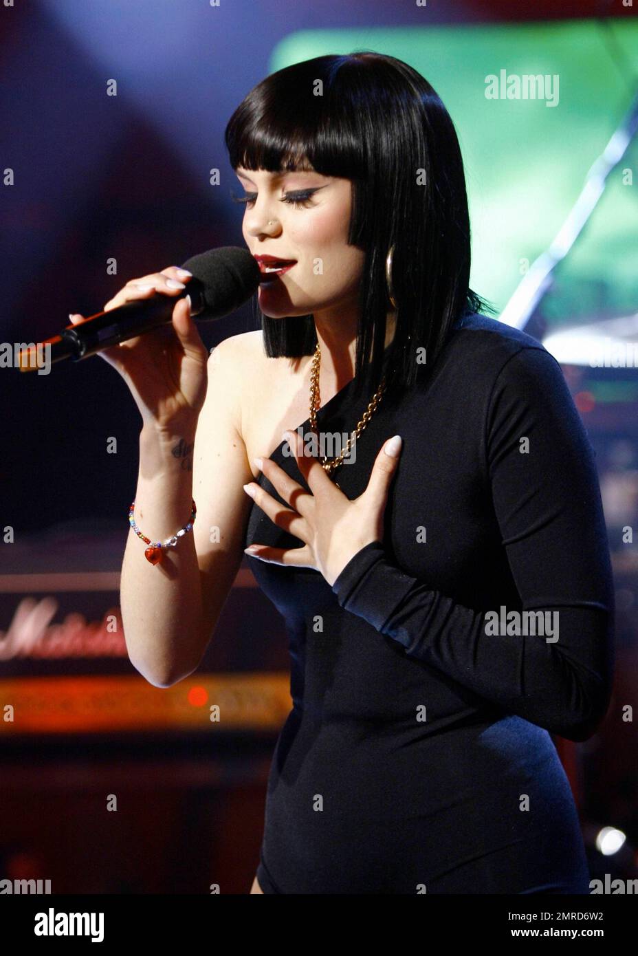 Wearing a black unitard with one black leg and a white one with a black ...