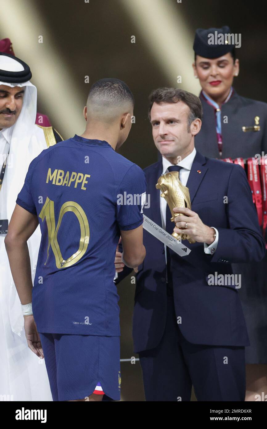 Emmanuel Macron (president of France) hands trophy to Kylian Mbappe ...
