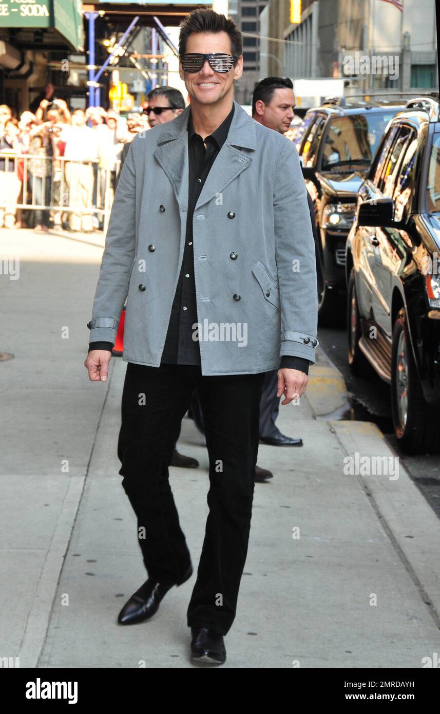 Jim Carrey Wears Some Funky Slatted Sunglasses As He Poses For Photos Outside The Late Show