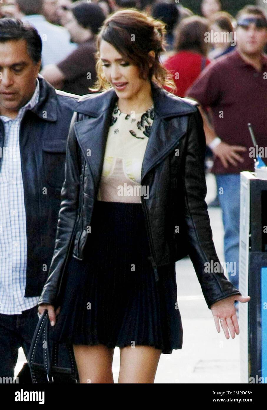 Jessica Alba waves to waiting fans as she arrives at the "Jimmy Kimmel ...