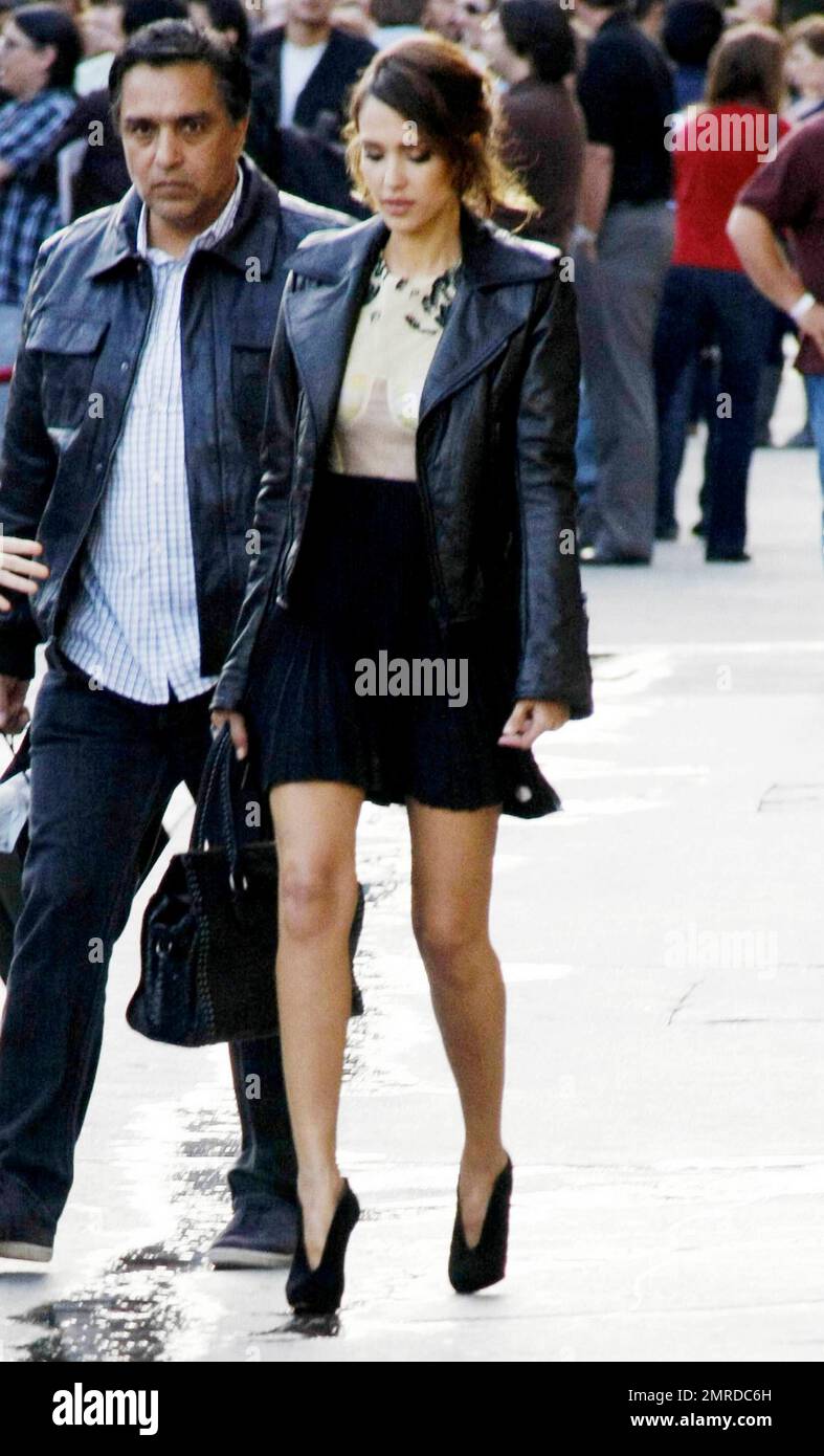 Jessica Alba waves to waiting fans as she arrives at the "Jimmy Kimmel ...