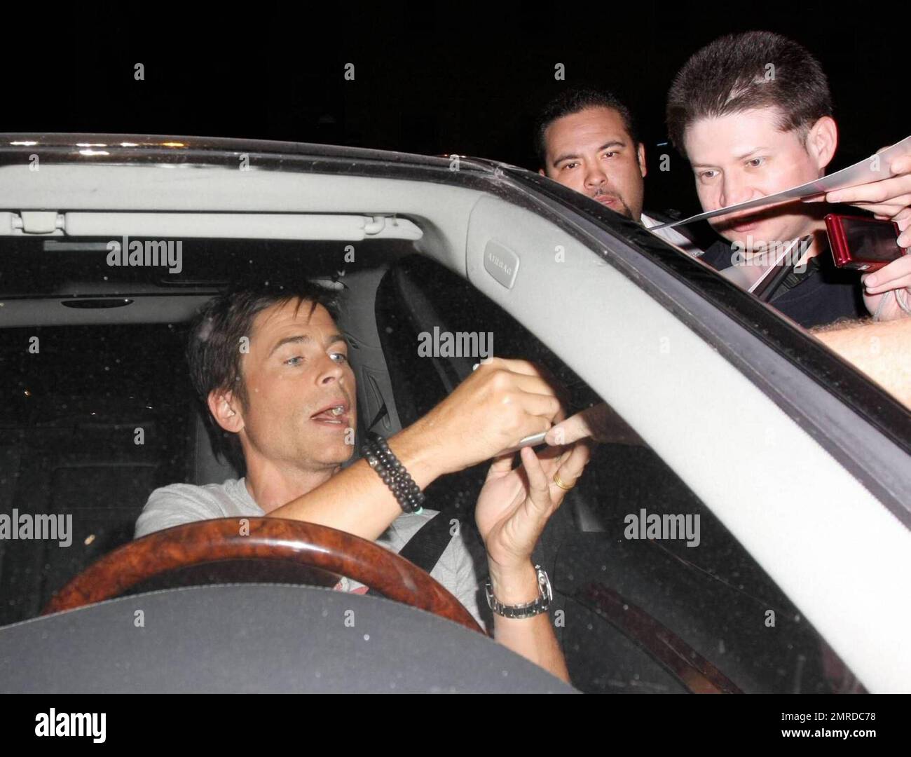 Rob Lowe signs autographs for fans while leaving the Jimmy Kimmel Show ...