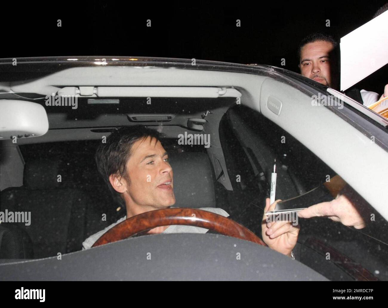 Rob Lowe signs autographs for fans while leaving the Jimmy Kimmel Show ...