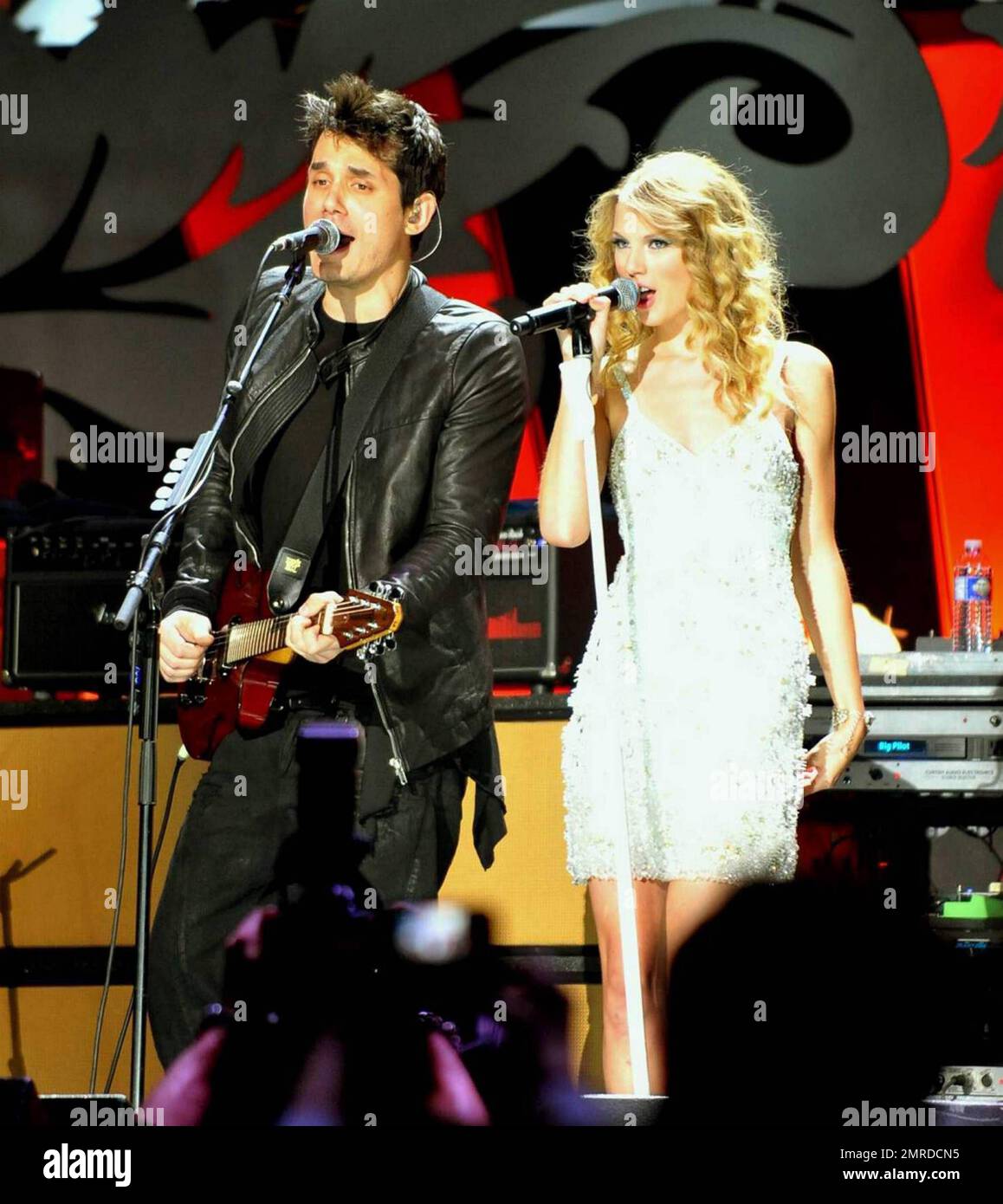 Singer John Mayer is joined by Taylor Swift on stage at the Z100 Jingle ...